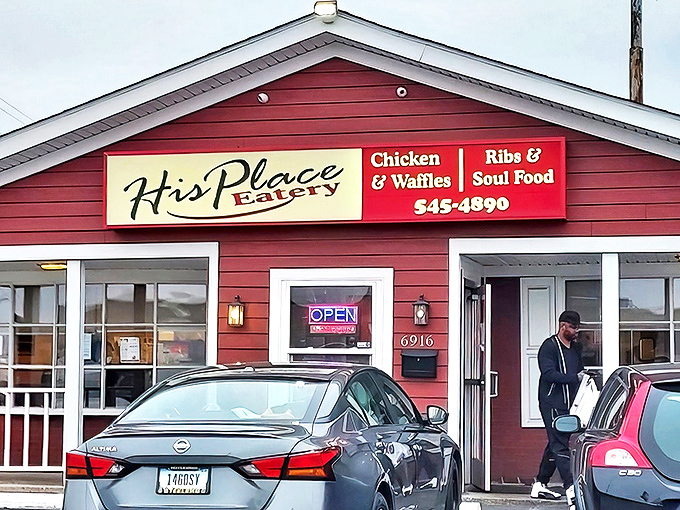 The barn-red exterior of His Place Eatery stands as a beacon of comfort food promise on Indianapolis's east side.