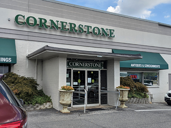 The unassuming exterior hides a treasure trove within. Those elegant stone planters are just the first hint of the wonders awaiting inside.