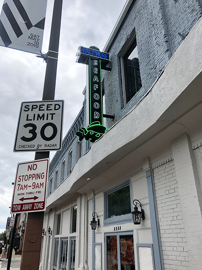 That vintage seafood sign beckoning from above promises culinary adventures that'll make your taste buds sing opera.