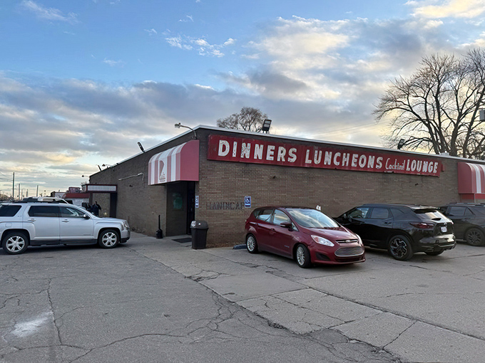 The unassuming brick exterior of Loui's Pizza proves once again that culinary treasures often hide behind modest facades. Michigan's pizza pilgrimage begins here.