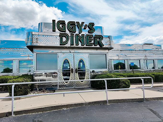 The gleaming stainless steel exterior of Iggy's Diner shines like a beacon on Route 66, promising classic American comfort with a side of nostalgia.