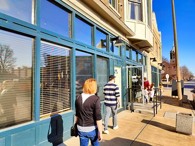 Stacked STL's charming brick exterior with teal trim invites you in like that friend whose kitchen always smells amazing. Architectural character meets burger paradise.