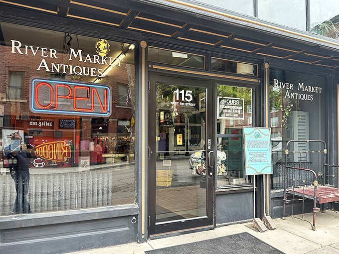 The unassuming storefront of River Market Antiques beckons with its classic neon "OPEN" sign—a portal to treasures spanning decades of American life.