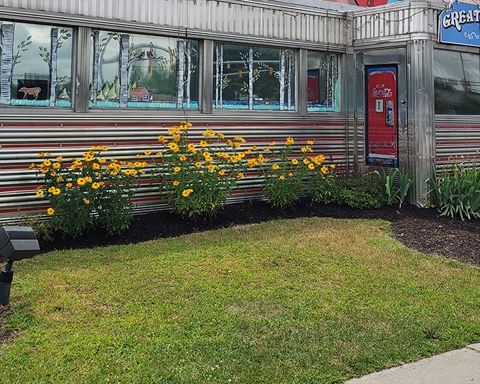 The classic stainless steel exterior of Tilt'n Diner gleams in the sunlight, a chrome time capsule promising comfort food and nostalgia inside.