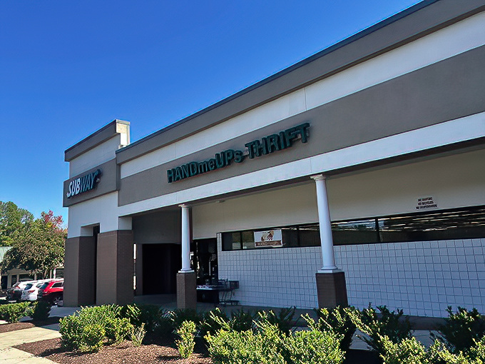 Strip mall treasures await! HandmeUPs Thrift sits unassumingly beside a Subway, like Clark Kent hiding Superman's cape under a business suit.