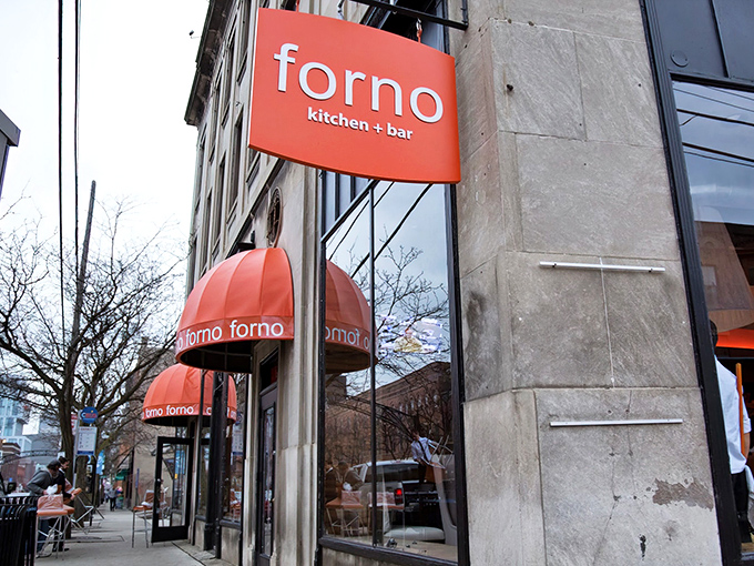 That vibrant orange sign isn't just eye-catching&mdash;it's a beacon of culinary delight in Columbus's Short North district. Food paradise, straight ahead!