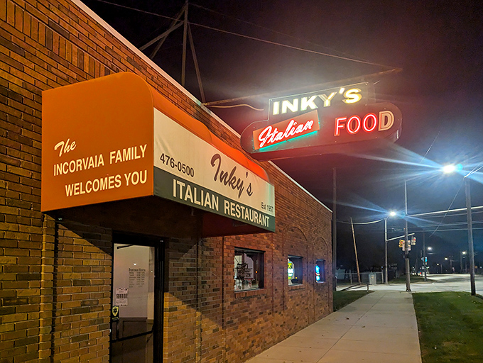 At night, Inky's neon sign glows like a beacon for hungry souls, guiding pasta pilgrims to this temple of Italian-American comfort food.