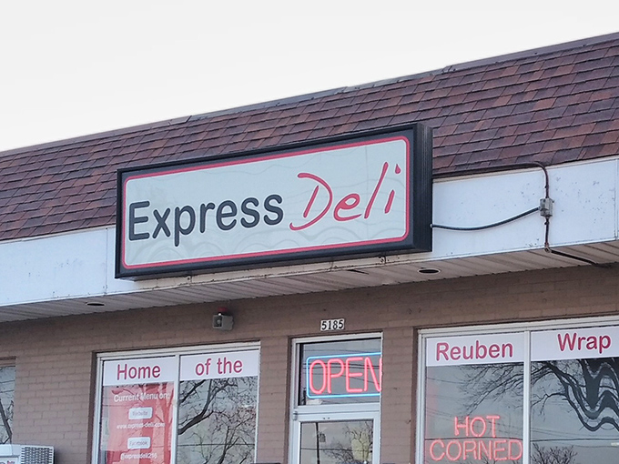 The unassuming storefront that houses culinary greatness. That neon "HOT CORNED BEEF" sign isn't just advertising&mdash;it's a promise.