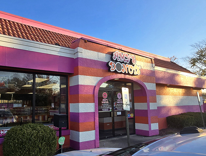 The pink and orange striped exterior of Amy's Donuts isn't just a building&mdash;it's a mood-lifting promise of the sugary joy waiting inside.