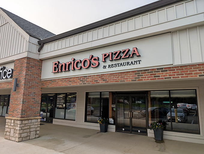 The unassuming storefront of Enrico's Pizza & Restaurant proves once again that culinary treasures often hide in plain sight, nestled between ordinary strip mall neighbors.