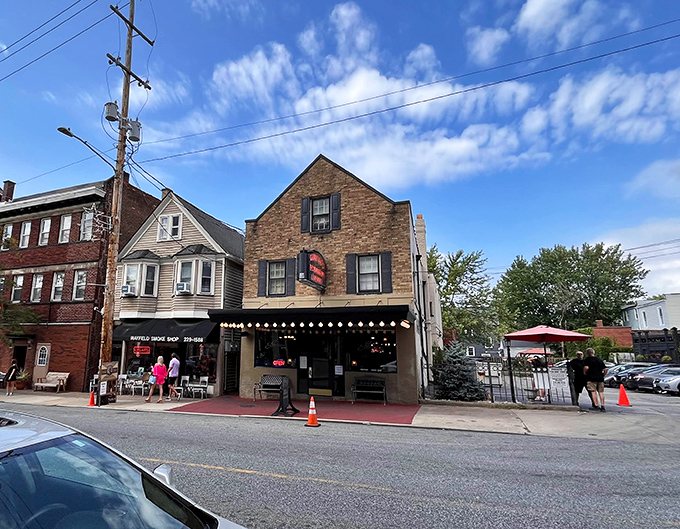 The unassuming brick exterior of Guarino's stands like a time capsule on Mayfield Road, string lights hinting at the warmth waiting inside.