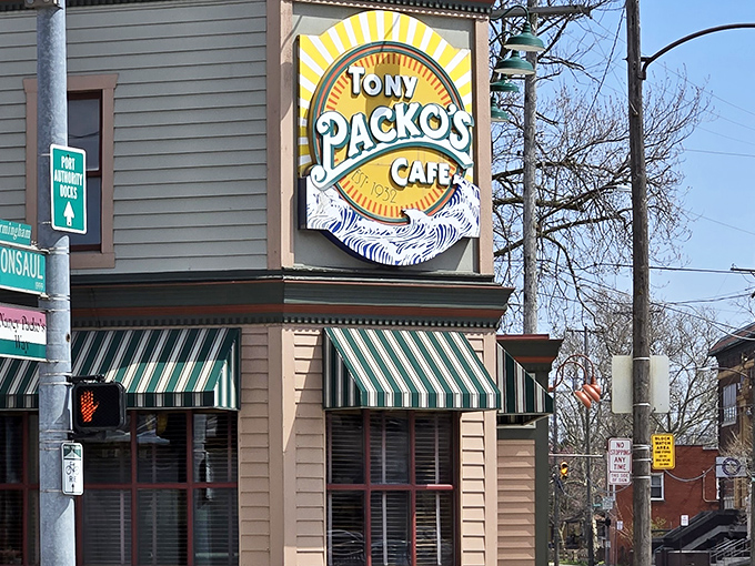 The iconic corner building with its cheerful yellow and green striped awnings stands like a culinary lighthouse in Toledo, beckoning hungry travelers home.