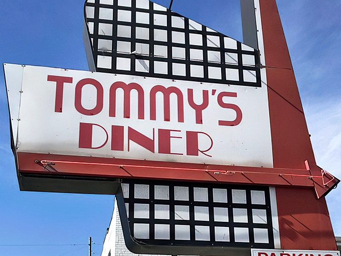 That iconic blue and black sign isn't just announcing a diner—it's promising a time machine to when calories were just numbers and comfort was king.