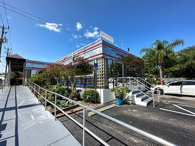 The gleaming silver exterior of Georgie's Diner shines like a beacon of breakfast hope in St. Augustine, complete with classic glass block windows and retro charm.