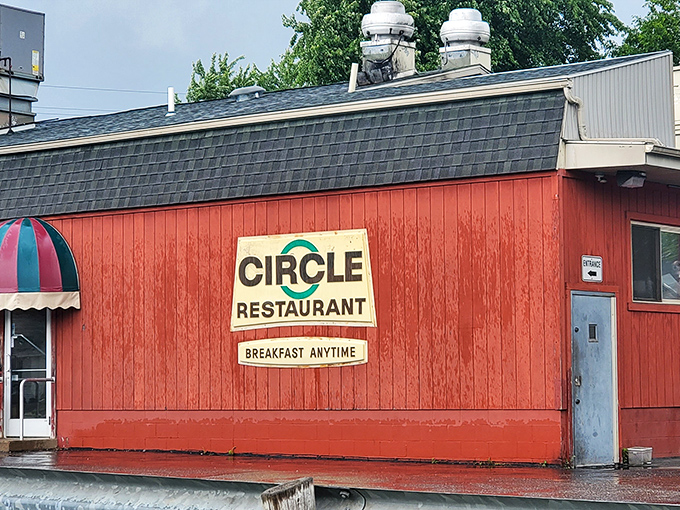 The bright red exterior of Circle Restaurant stands like a beacon of comfort food in Deerfield, promising "Breakfast Anytime" to hungry travelers and locals alike.