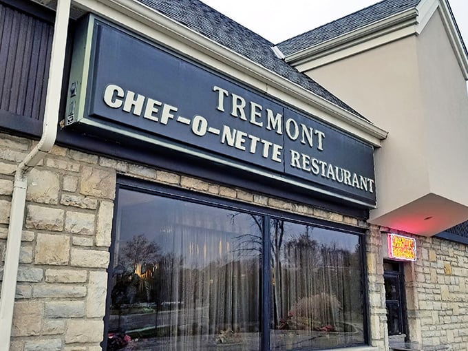 The stone facade of Tremont Center houses this beloved time capsule of American dining. Chef-O-Nette's sign promises comfort food that's stood the test of time.