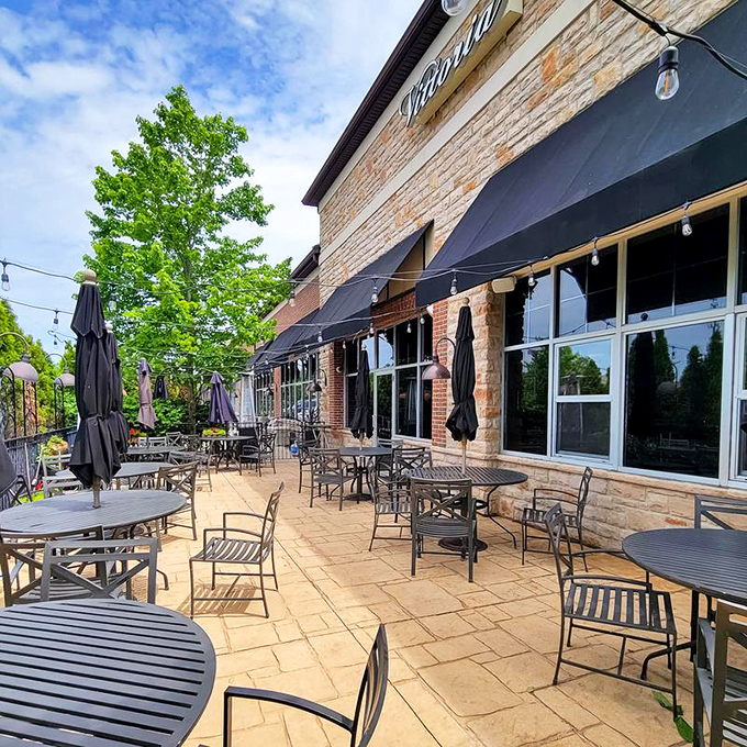 Vittoria's inviting patio beckons with stone flooring and string lights, promising al fresco dining that rivals any Tuscan countryside experience.