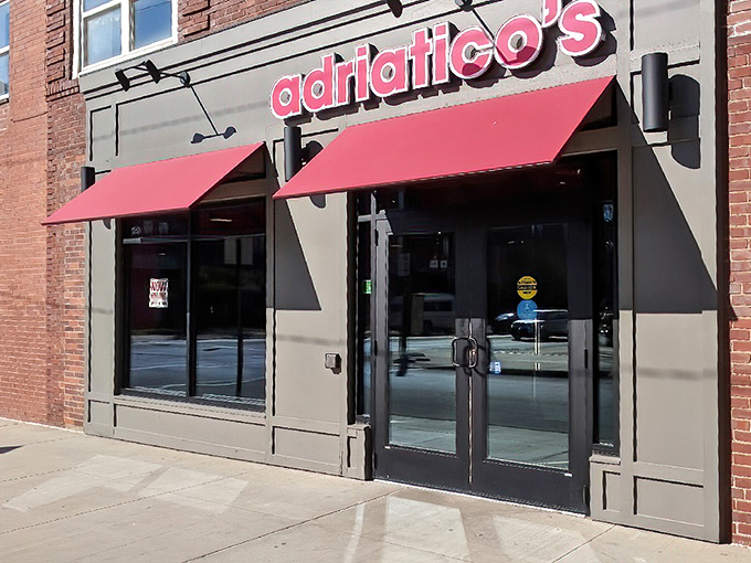 The iconic red awnings of Adriatico's beckon pizza lovers like a lighthouse guides ships &ndash; a beacon of cheesy hope on the Columbus landscape.