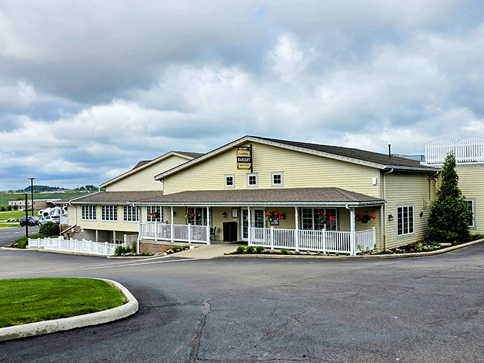 The welcoming yellow exterior of Dutch Valley Bakery stands like a beacon of carb-laden hope in Sugarcreek's rolling countryside.