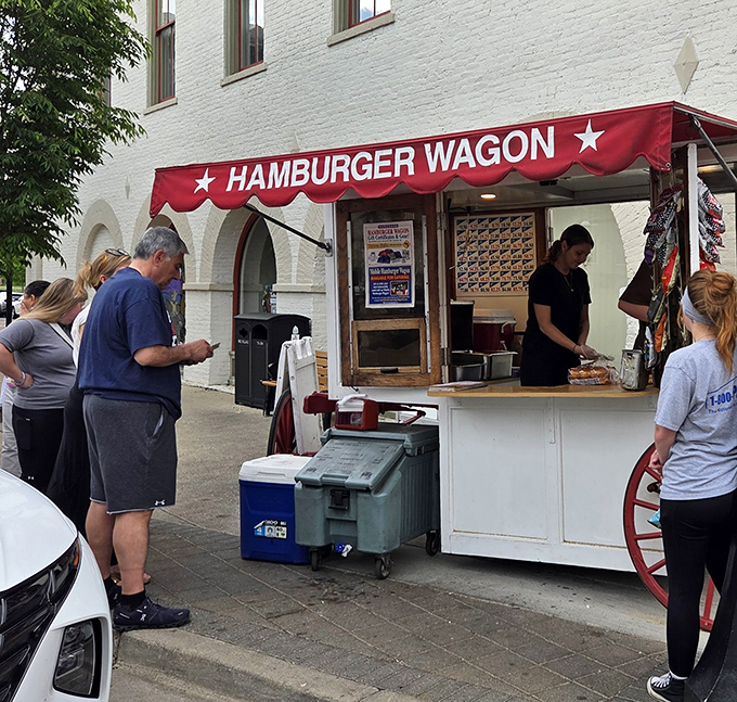 The iconic red awning beckons like a culinary lighthouse on Miamisburg's brick-paved streets. Simple, unassuming, and hiding a century of burger perfection.