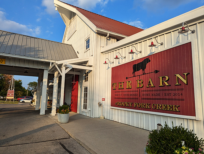 The white barn exterior with striking red accents isn't just farm-chic architecture&mdash;it's nature's way of saying "good food lives here."