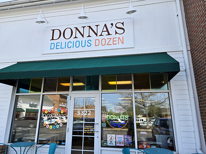 The unassuming storefront of Donna's Delicious Dozens beckons with its cheerful turquoise chairs and simple signage&mdash;proof that donut paradise often hides in plain sight.