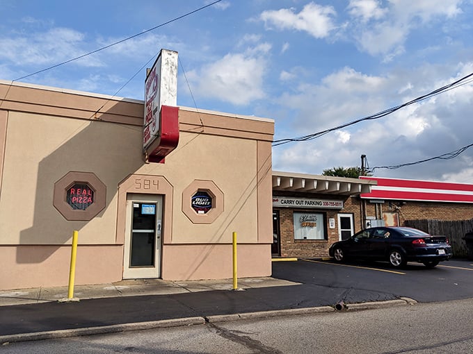 The unassuming exterior of The Elmton stands like a time capsule in Struthers, promising comfort food treasures within its modest walls.