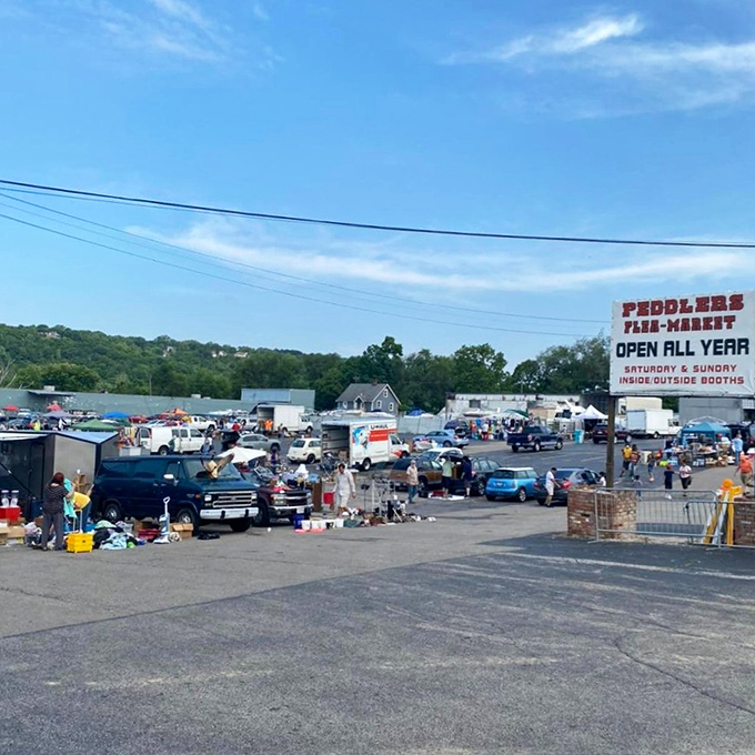 The sprawling landscape of Peddlers Flea Market under Cincinnati's blue sky &ndash; where one person's castoffs become another's treasures every weekend.