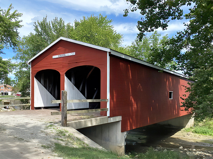 This crimson beauty stands like a welcoming giant, ready to transport you back to simpler times.