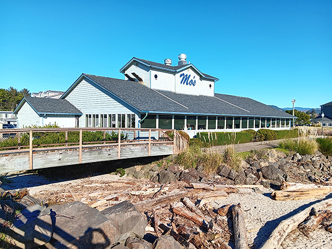 The coastal charm of Mo's, with its blue-gray siding and beachfront perch, lures road-trippers in search of ocean views and legendary seafood favorites.