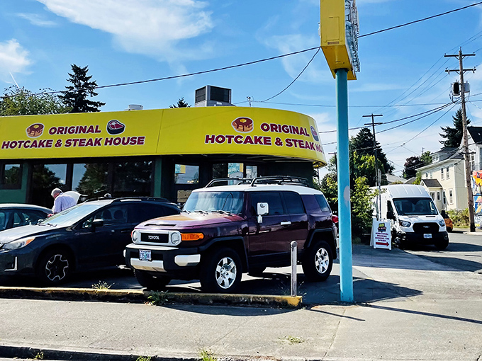 The sunshine-yellow exterior isn't just a color choice&mdash;it's a beacon of hope for hungry travelers at any hour.