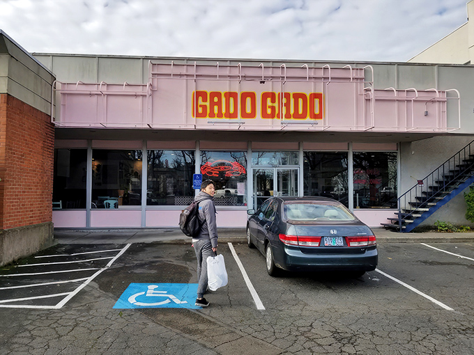 The neon-lit "GADO GADO" sign glows like a beacon of culinary adventure, promising Indonesian delights in Portland's vibrant dining landscape.