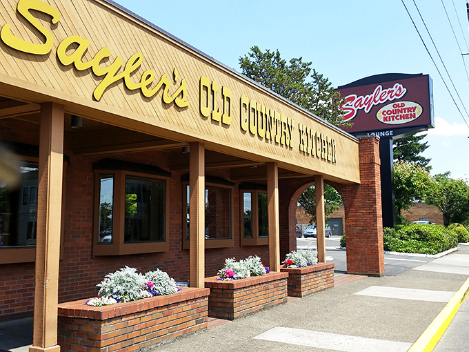 The iconic yellow sign beckons like a lighthouse for the steak-obsessed. This Portland landmark has been guiding hungry souls home for generations.