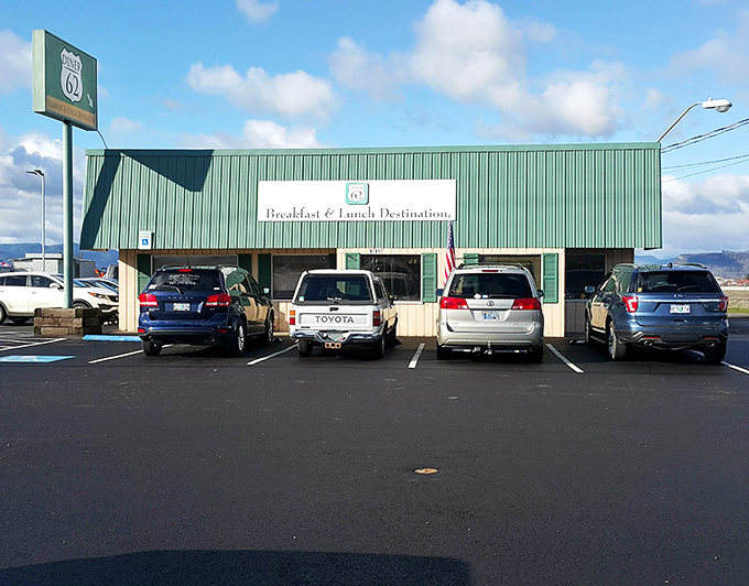 The green exterior of Diner 62 stands like a beacon for hungry travelers, promising comfort food salvation just off the highway.