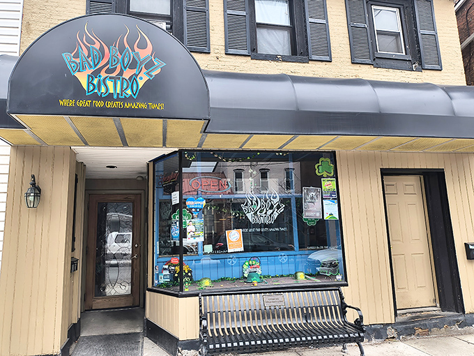 The flame-adorned sign promises adventure for your taste buds. Bad Boyz Bistro's unassuming exterior hides culinary treasures waiting to be discovered.