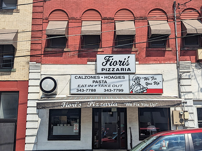 The classic red brick fa&ccedil;ade of Fiori's Pizzaria stands as a beacon of hope for the pizza-deprived. "We Fix You Up" isn't just a motto&mdash;it's a promise.