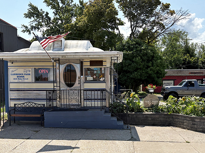 The iconic blue-striped railroad car with its bold red "DINOR" sign stands as Erie's time capsule of comfort food glory.