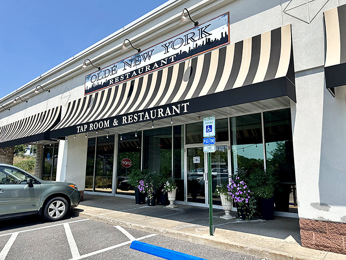 The classic striped awning and vintage signage of Olde New York isn't just inviting&mdash;it's practically waving you in for pierogies and good times. 