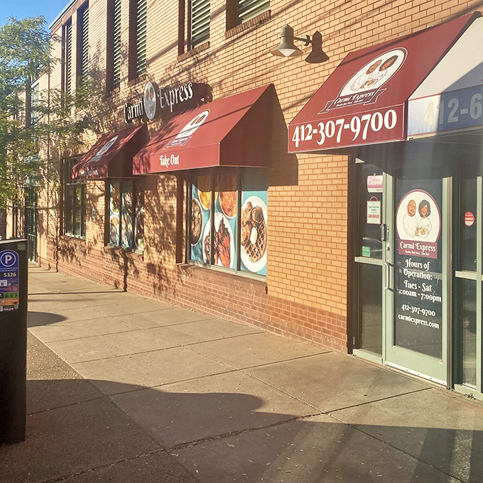 The unassuming brick exterior with bold red awnings is like a secret handshake &ndash; those who know, know this is where Pittsburgh's soul food magic happens.