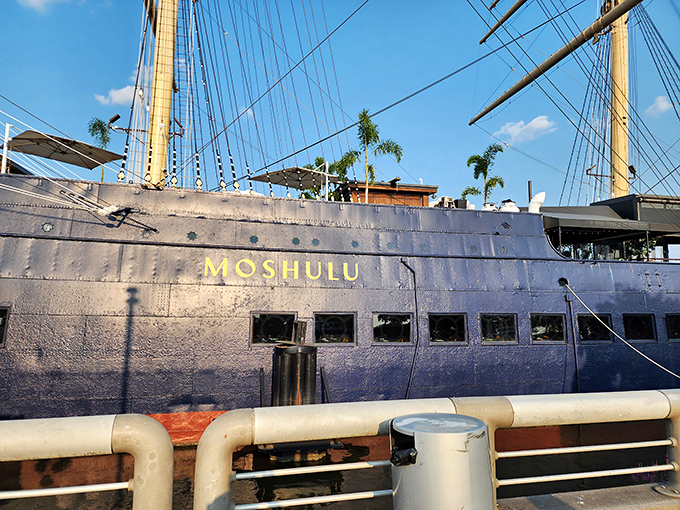 The grand Moshulu stands proudly at Penn's Landing, its yellow masts reaching skyward like exclamation points celebrating Philadelphia's maritime history.