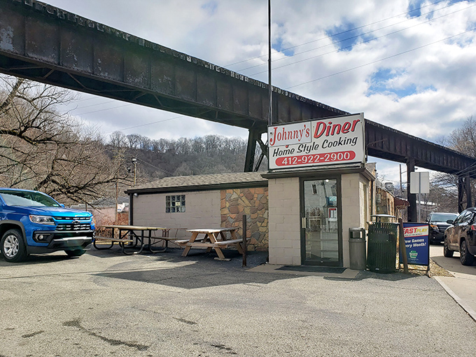 Tucked beneath Pittsburgh's industrial embrace, this humble diner proves that extraordinary breakfast adventures hide behind ordinary facades.
