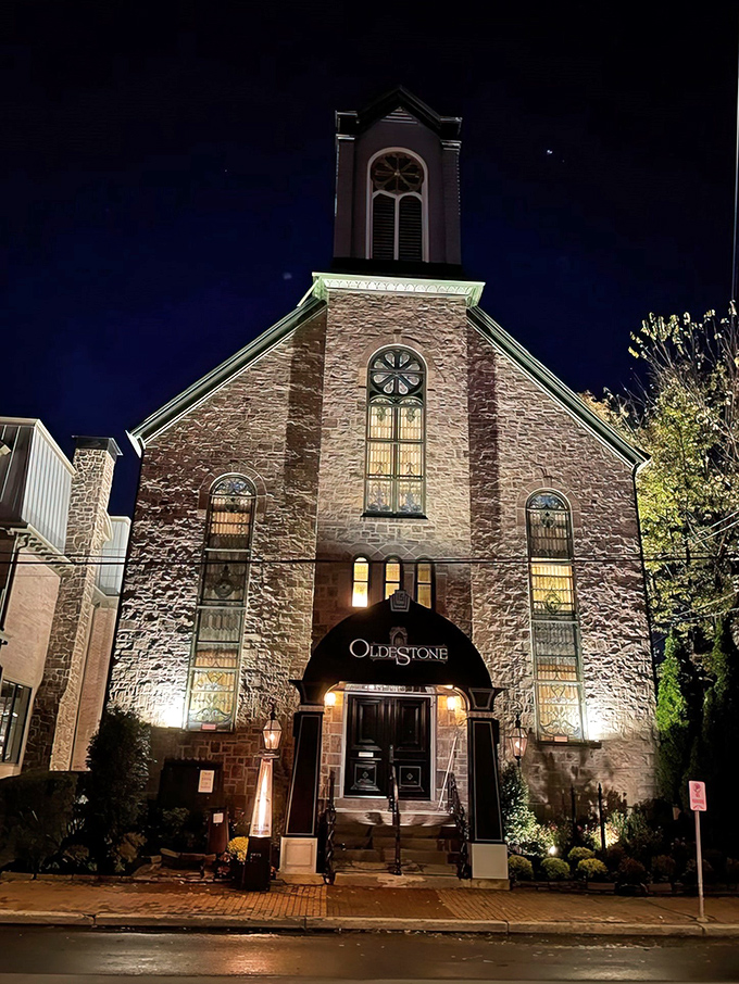 The stone facade of Oldestone glows with promise at night, its elegant awning beckoning hungry travelers like a lighthouse for carnivores.