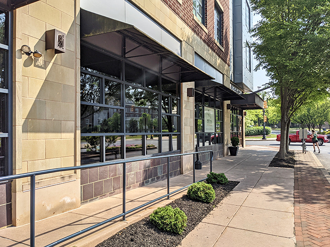 The modern fa&ccedil;ade of Iron Hill beckons with its inviting patio, promising craft beer nirvana and burger bliss just steps from Lancaster's bustling streets.