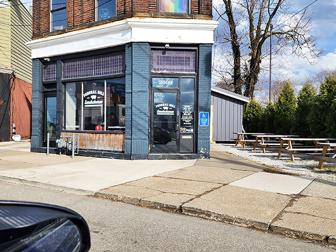 The unassuming blue brick corner building doesn't scream "barbecue destination" until you catch that first whiff of hickory smoke wafting through the Erie air.