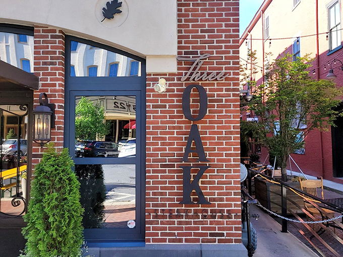 The iconic brick facade of Three Oak Steakhouse welcomes you like an old friend who happens to be exceptionally good at grilling things.