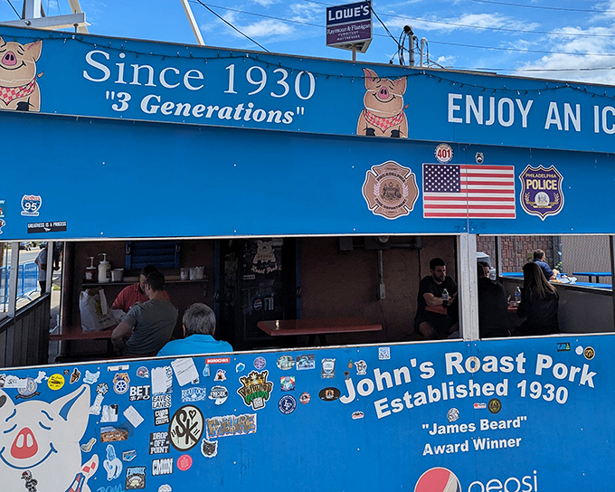 The iconic blue exterior of John's Roast Pork stands out like a culinary lighthouse, beckoning sandwich pilgrims with its no-nonsense charm and James Beard credentials.