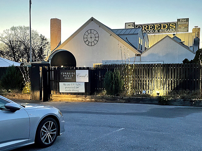 The classic black awning of Creed's welcomes you like an old friend who happens to know their way around a perfect seafood tower.