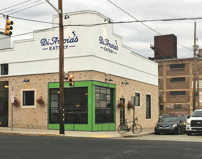 By day, this Strip District gem stands proud with its crisp white facade and signature green accent&mdash;Pittsburgh's little slice of Italy.