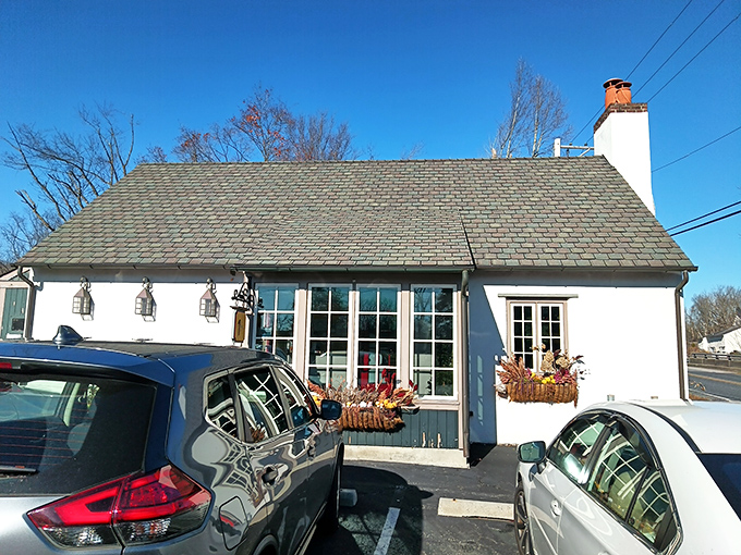 The quintessential British countryside escape, transported brick by brick to Pennsylvania's rolling hills. This charming white cottage promises authentic flavors within its unassuming walls.