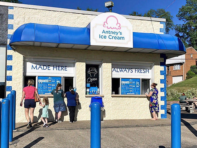 The blue-awninged beacon of frozen delight stands proudly in Pittsburgh, promising handmade happiness with its "MADE HERE, ALWAYS FRESH" guarantee.